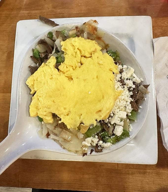 A skillet that's a beautiful mess of potatoes, eggs, and veggies – the breakfast equivalent of hitting the jackpot at a Vegas casino.