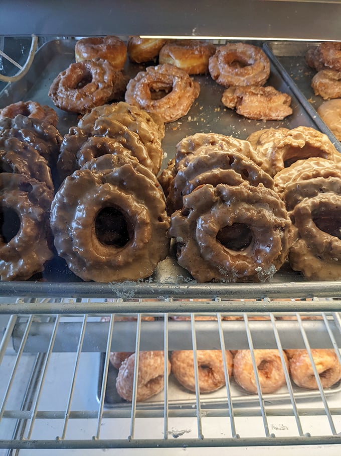 Old-fashioned donuts with their characteristic cracks and crevices—nature's way of creating more surface area for that glorious glaze.