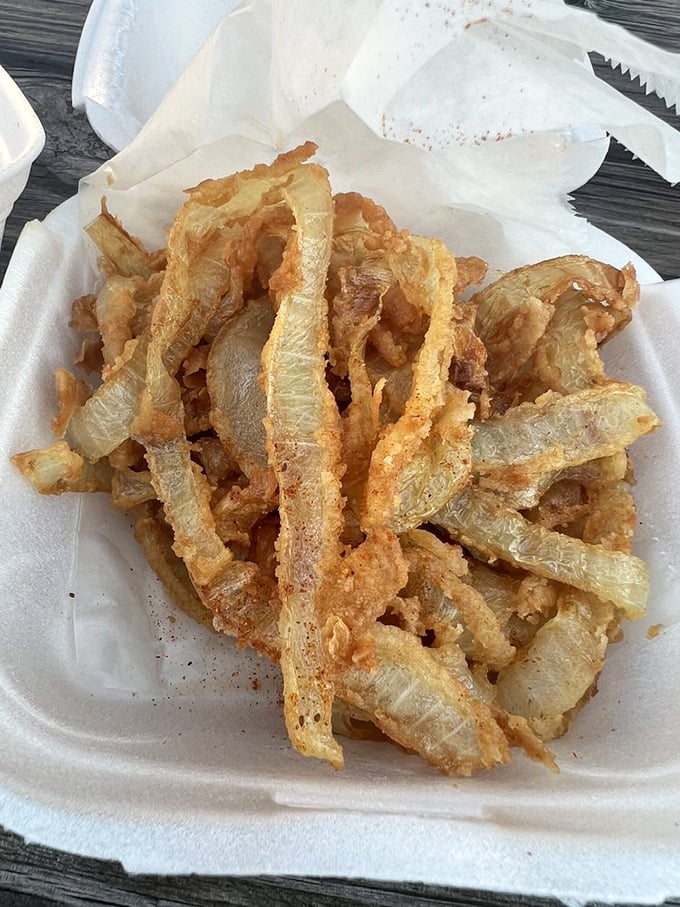 Thee Onion Thangs aren't just onion rings—they're golden halos of crispy, battered perfection that deserve their own special place in the side dish hall of fame.