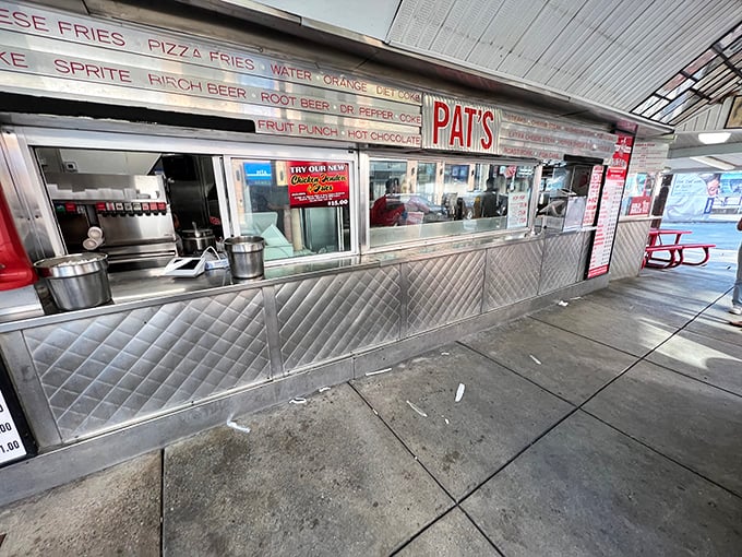 The hallowed window where dreams become reality. Notice the stainless steel shine—that's the gleam of decades of sandwich perfection.