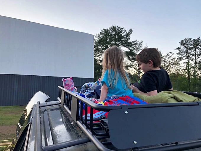 Truck bed cinema at its finest—where kids create the kind of childhood memories that will someday make them nostalgic parents themselves.