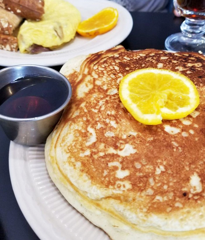 This pancake isn't just big—it's Ohio big. Golden, fluffy, and taking up real estate on the plate like it's paying rent.