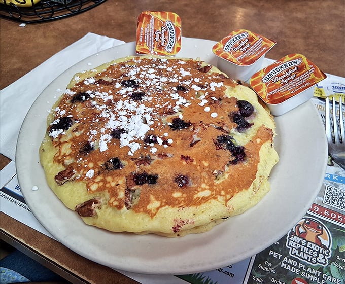 Blueberry pancakes that could convert waffle loyalists – fluffy, golden, and studded with berries that burst with every bite.