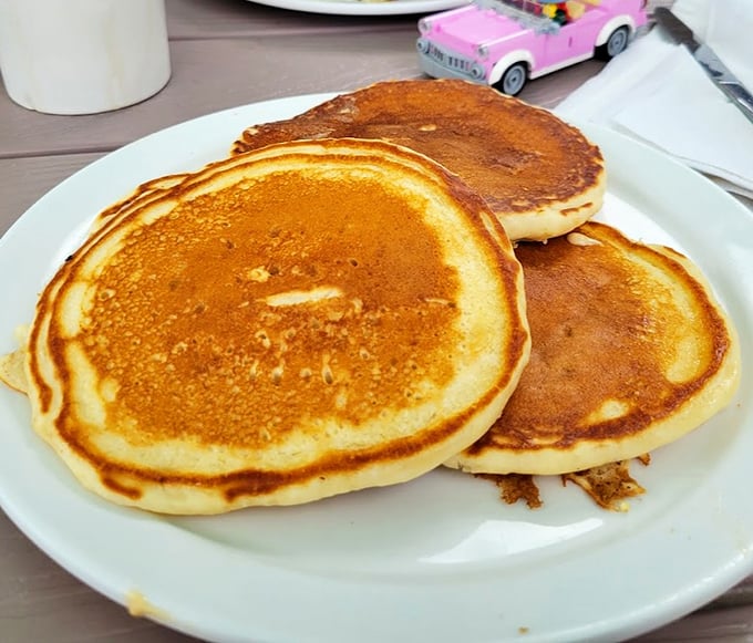 Pancakes stacked like golden coins from a breakfast treasure chest.