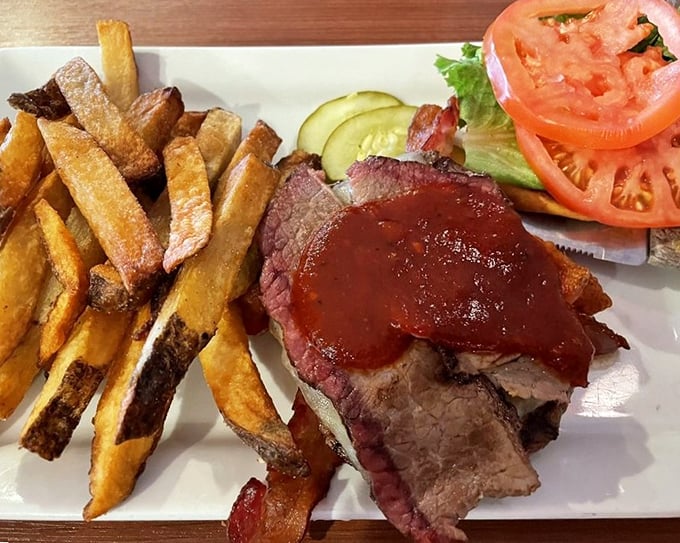 A pastrami sandwich that doesn't need New York's permission to be magnificent, served with fries that deserve their own fan club.