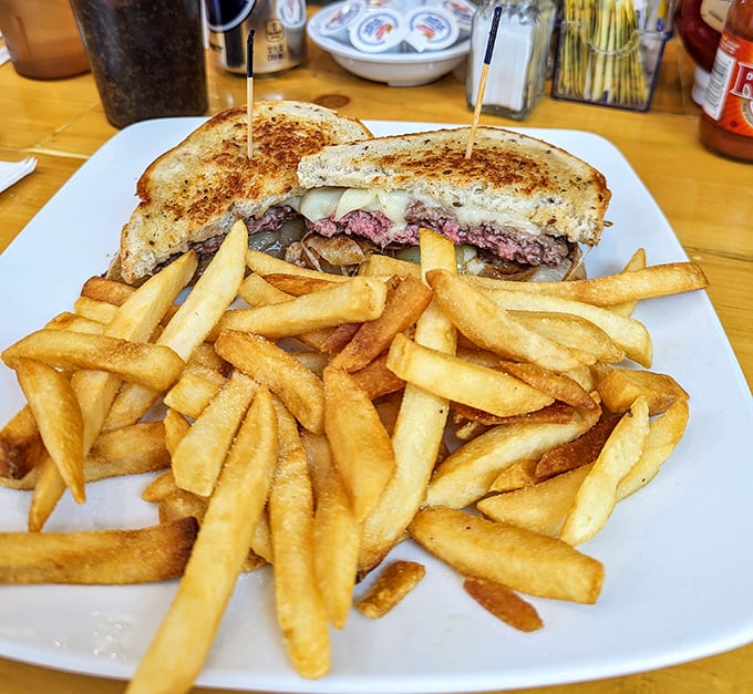 This patty melt doesn't just satisfy hunger—it negotiates peace treaties between warring taste buds with diplomatic grilled onions.