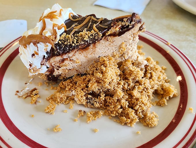 Peanut butter pie with chocolate drizzle and crumb topping—proof that sometimes the best things in life require absolutely no justification whatsoever.