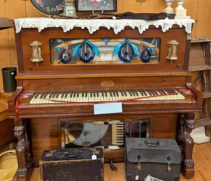 This isn't just a piano – it's a time machine with keys. The stained glass and worn ivories hint at parlor songs and family gatherings long before Netflix existed.