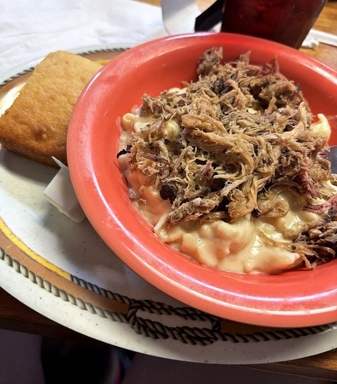 The legendary Piggy Mac – where pulled pork meets mac and cheese in a relationship more perfect than any Hollywood romance.