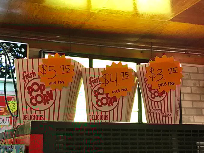 Popcorn pricing that tells a story of portion sizes. From "I'm just a little hungry" to "I'll be snacking through both features."