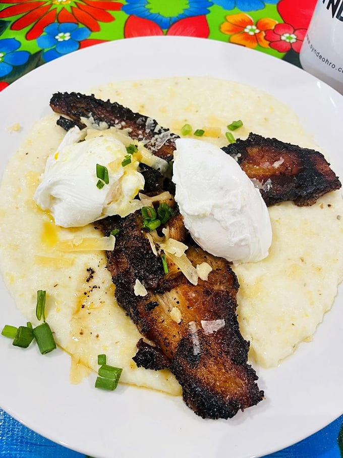 Crispy pork belly atop creamy grits with poached eggs—Southern comfort food that would make even a Yankees fan consider relocating below the Mason-Dixon.