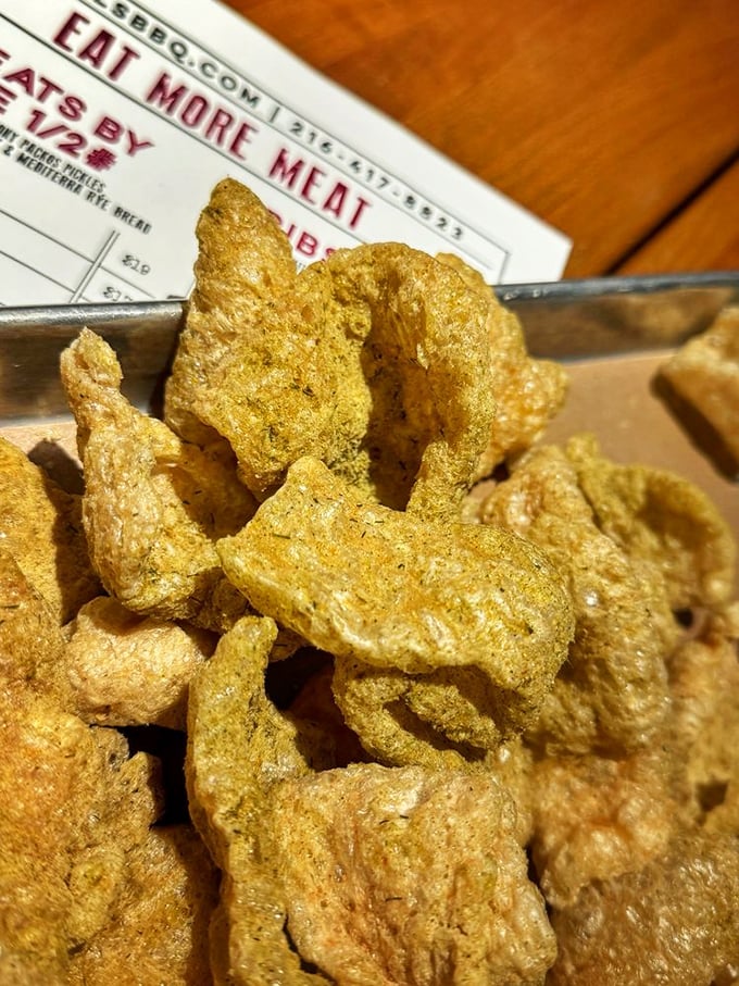 Cracklins that shatter like delicious pork glass—the perfect crunchy counterpoint to all that tender, smoky meat.