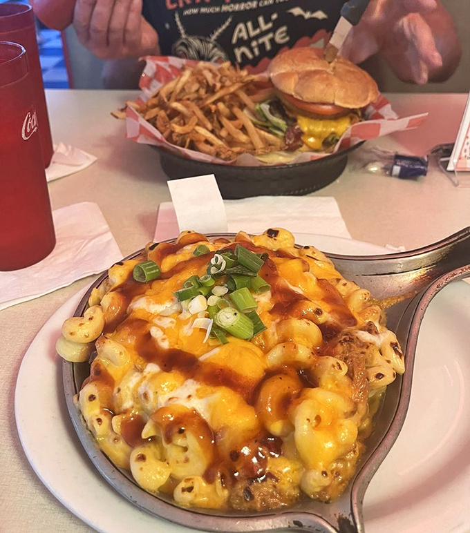 Mac and cheese that's having an identity crisis as a loaded baked potato—and we're here for every cheesy, green-onion-topped bite of it. 