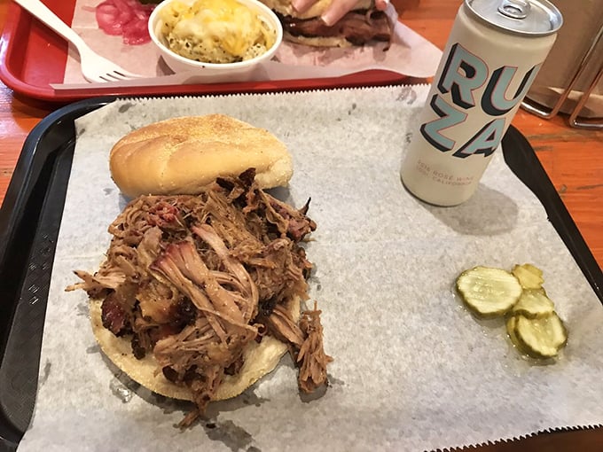 The open-faced pulled pork sandwich: when you're too excited about the meat to bother with closing your sandwich. Those pickle chips aren't just watching—they're waiting. 