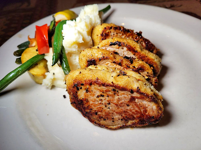 Pork tenderloin medallions, perfectly seared and seasoned. The kind of dish that makes you close your eyes with each bite.