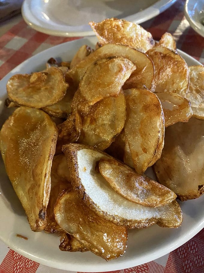 These aren't your average potato chips—they're house-made slices of potato transformed into crispy, golden treasures that put the bagged variety to shame.