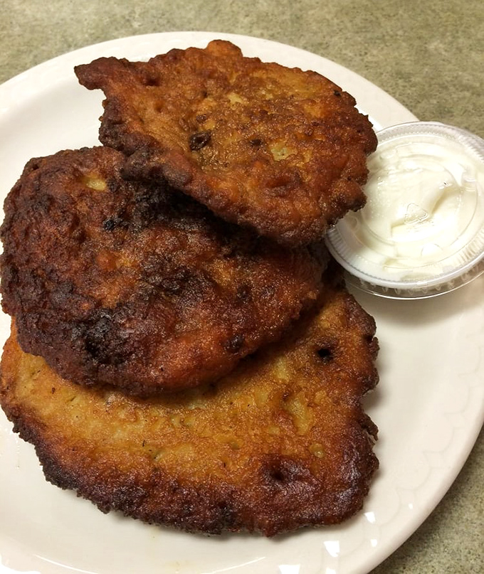 Potato pancakes with the perfect contradiction: shatteringly crisp exteriors giving way to tender, savory interiors that beg for a dollop of sour cream.