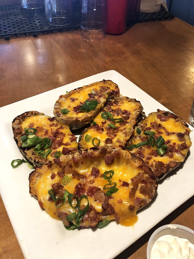 Potato skins loaded with cheese, bacon, and green onions – because sometimes you need comfort food that doesn't apologize for anything.