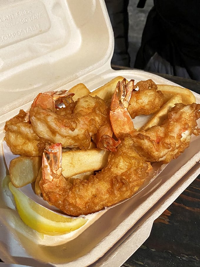 These prawns aren't just battered—they're armored in golden crispiness, ready to dive into the pool of tartar sauce on your plate.