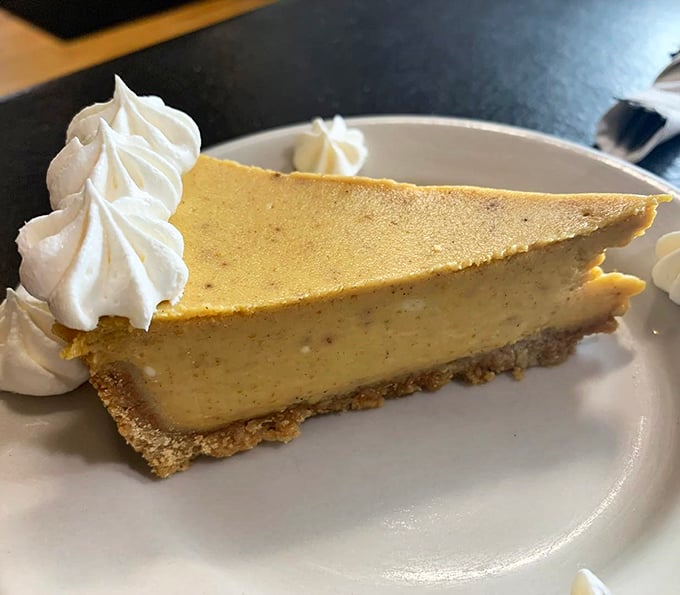 Cheesecake that achieves that mythical balance between rich decadence and cloud-like lightness, with dollops of whipped cream for good measure.