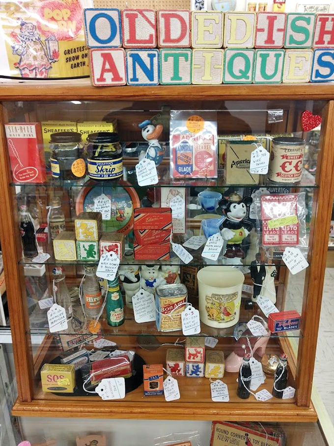 Vintage advertising comes alive in this carefully arranged cabinet. That Mickey Mouse figure has witnessed more American history than most history professors.