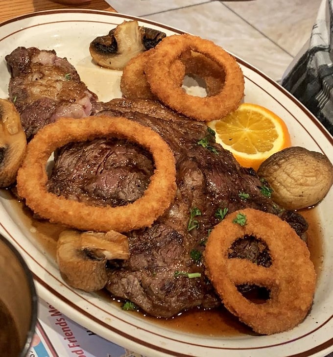 A rib-eye steak adorned with golden onion rings – proof that diners can deliver steakhouse quality without the steakhouse attitude.