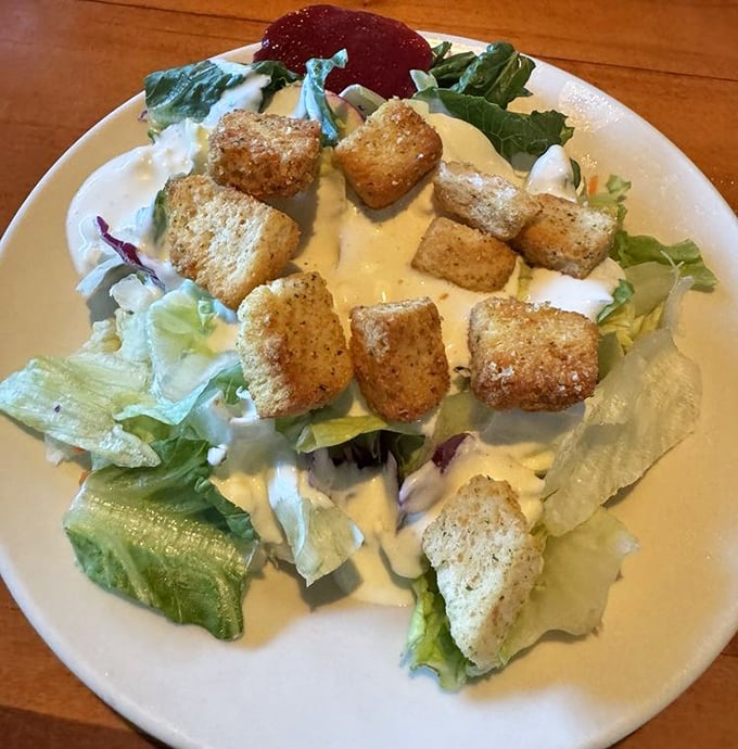 A salad that knows its role in the steakhouse experience—the opening act that sets the stage for the headliner.