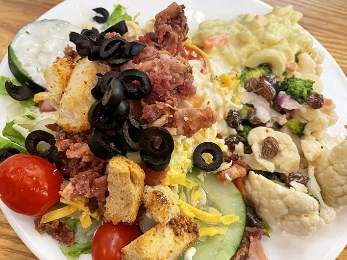 This isn't just a salad—it's a colorful rebellion against boring greens, loaded with bacon, cheese, olives and enough toppings to make vegetables exciting again.