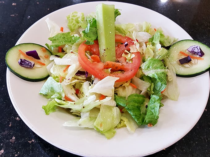 A fresh garden salad provides that moment of virtuous balance before diving back into the glorious carb-laden main event.
