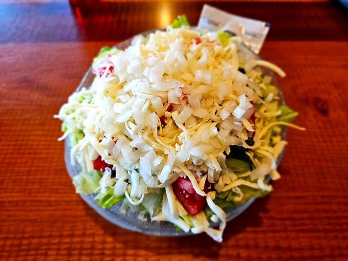 Even the salads here refuse to be boring – that mountain of cheese says "diet starts tomorrow."