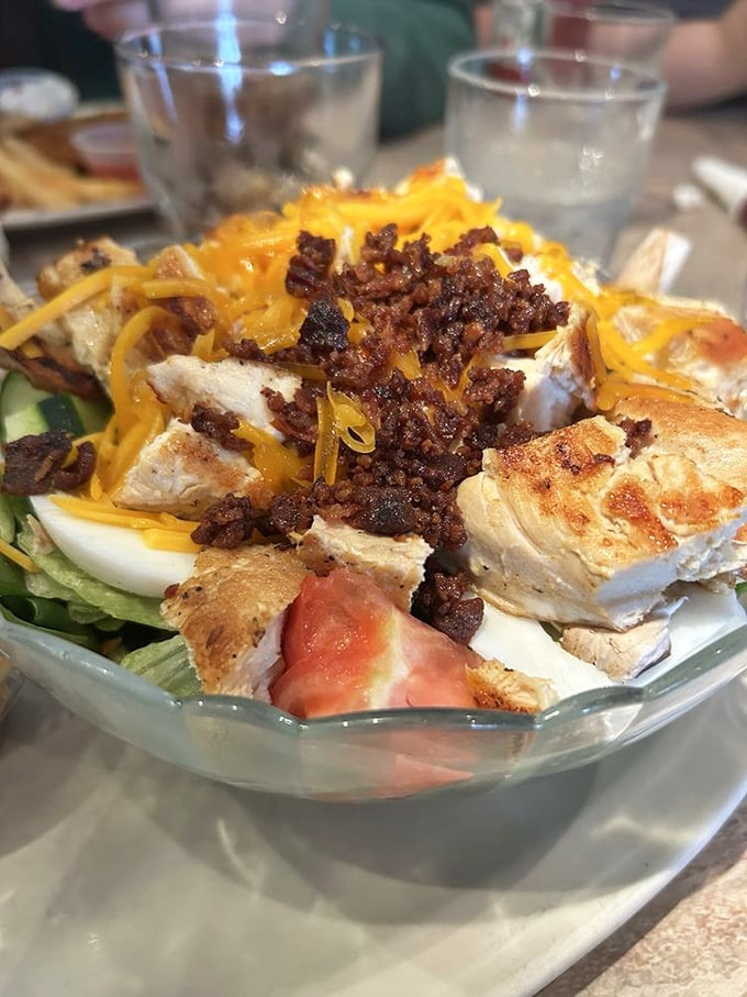 A chef's salad that actually satisfies. This isn't rabbit food – it's a protein-packed masterpiece topped with enough cheese to make a cardiologist nervous.