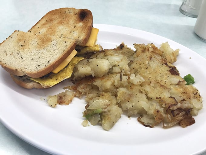 This breakfast sandwich isn't just assembled—it's architected, with layers of egg, cheese, and toast creating the perfect handheld morning masterpiece.