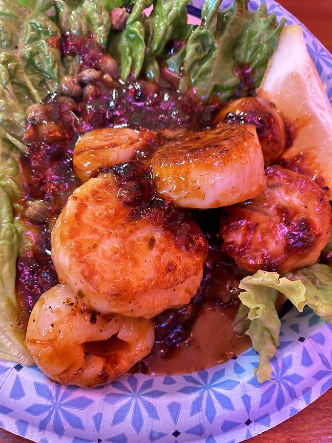 These scallops aren't just seared—they're transformed into buttery islands in a sea of sauce that makes you want to request a side of bread for necessary mopping operations.