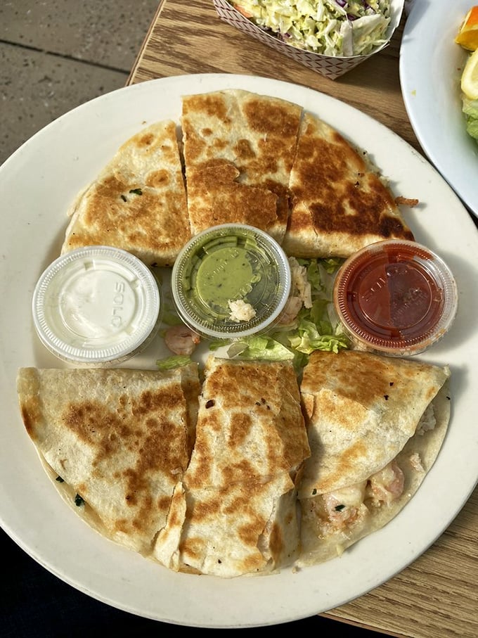 Quesadillas reimagined by Neptune himself – where cheese meets seafood in a crispy, golden tortilla embrace that defies tradition.