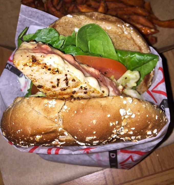The ahi sandwich—where health food meets indulgence in a perfect coastal compromise. Those sweet potato fries aren't just a side, they're a statement.