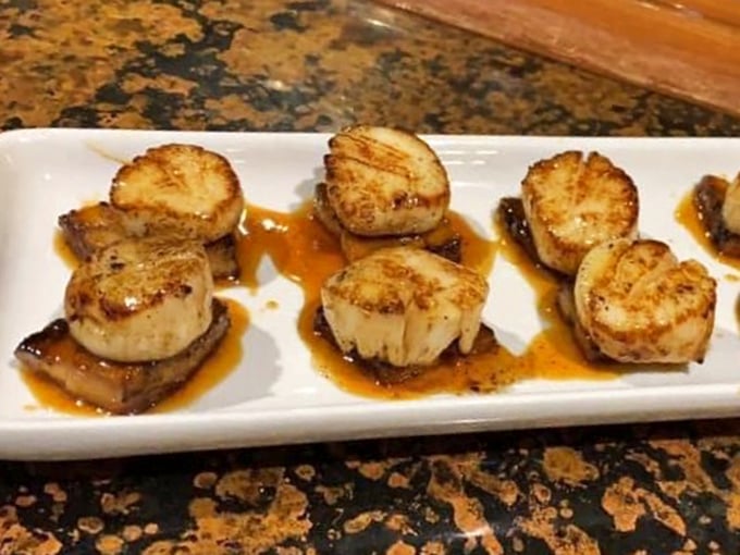 These seared scallops with caramelized edges look like they're auditioning for a food magazine cover—and absolutely nailing the callback.