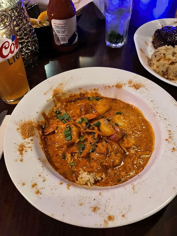 A bowl of jambalaya so authentic you'll check your GPS to make sure you're still in Delaware. The rice below is soaking up flavor like a tasty sponge.