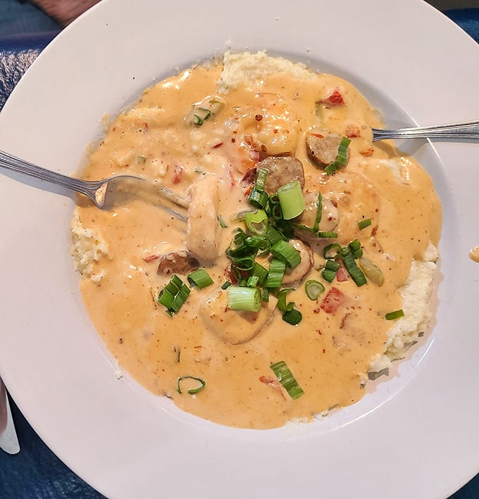 Shrimp and grits that whisper sweet nothings to your taste buds—creamy, savory, and topped with enough green onions to count as a vegetable.