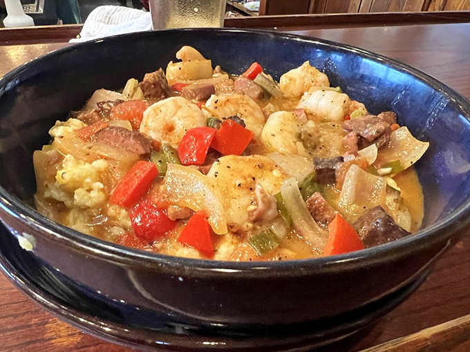 Shrimp and grits that would make a Southerner weep with joy. That rich broth isn't just liquid—it's a carefully crafted flavor delivery system.