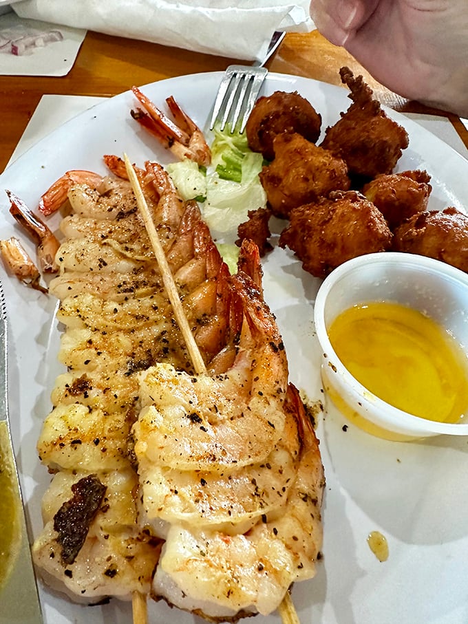 These grilled shrimp skewers and hush puppies aren't just a meal—they're edible postcards from coastal Florida.
