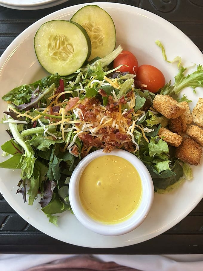 Even the side salad gets the star treatment—fresh greens, crisp vegetables, and house-made dressing that makes you wonder why you ever settled for the sad desk salad back home.