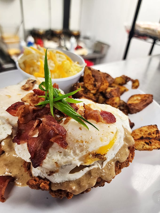 When breakfast gets dressed for dinner – a perfectly fried chicken throne atop a gravy-laden biscuit with an egg crown.