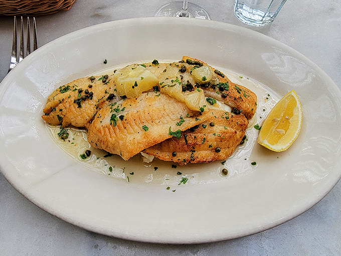 Sole meunière that would make Julia Child proud – delicate fish bathed in brown butter, brightened with lemon and parsley, simplicity that speaks volumes about skill.