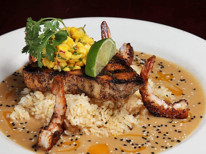 Southwest swordfish perched atop rice with mango salsa and shrimp—proof that landlocked Pennsylvania can deliver seafood worthy of coastal envy.