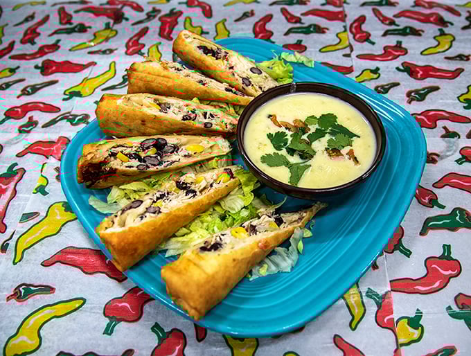 Southwestern egg rolls: where cultures deliciously collide on a turquoise plate, with a creamy dipping sauce that deserves its own fan club.