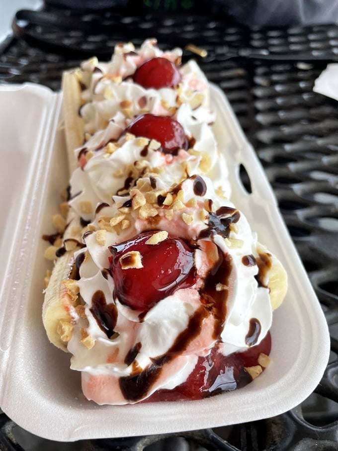 This banana split isn't just dessert—it's three scoops of childhood nostalgia topped with cherries and permission to indulge.