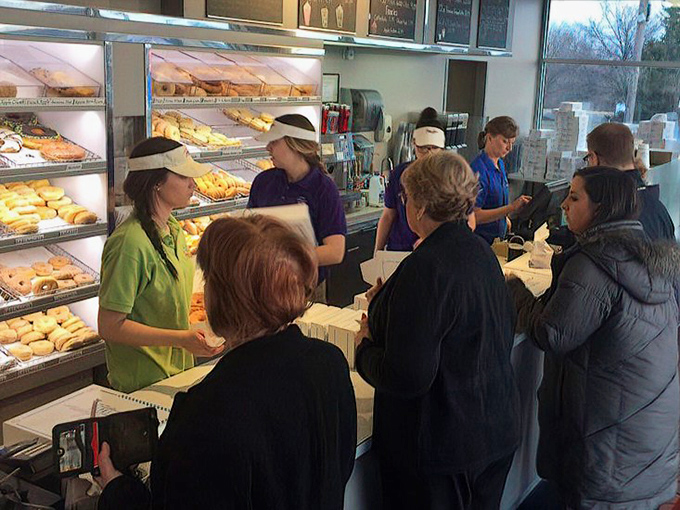 The weekend rush at Yum Yum – where patience is rewarded with freshly made treasures and the staff moves with practiced precision.