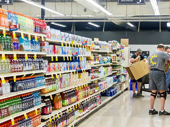 Shoppers navigate aisles of beverages and snacks, proving Salt & Light isn't just about secondhand treasures—it's a one-stop community resource.