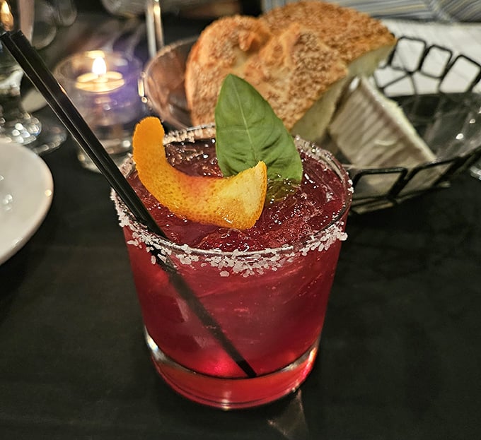 This cocktail isn't just a drink—it's a sunset in a glass, complete with a citrus horizon and salt-crystal stars.