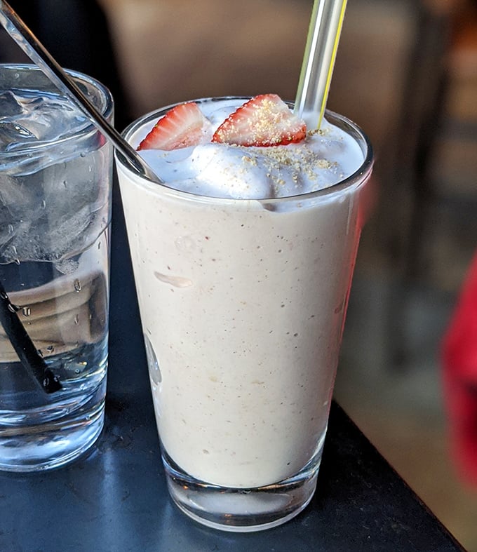 This strawberry milkshake isn't just dessert—it's what clouds would taste like if they were made of happiness.